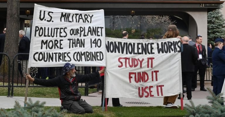 Protesters object to militarization of space at annual symposium in ...
